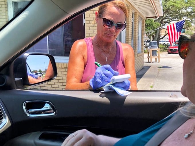The time-honored tradition of carhop service continues. Order taken with a smile, delivered with efficiency—American dining culture preserved.