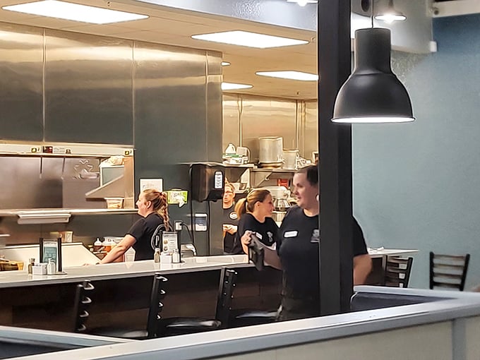 The kitchen crew in their element – where the magic happens behind a symphony of sizzles, clangs, and occasional bursts of flame.