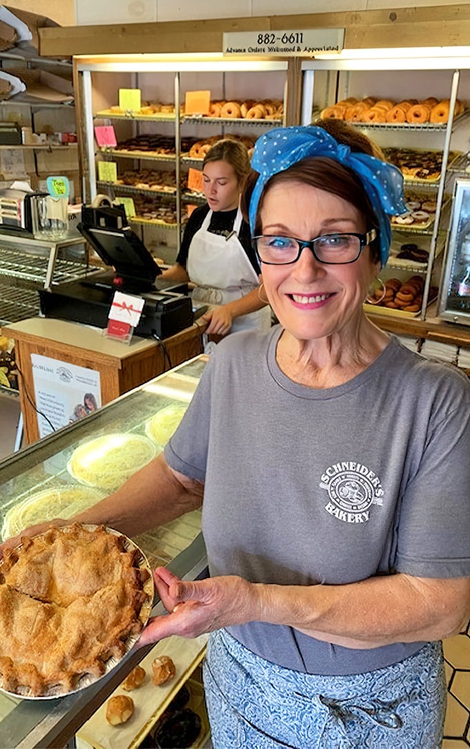 That smile says it all—when you've mastered the art of pie-making, you've essentially discovered the formula for human happiness.