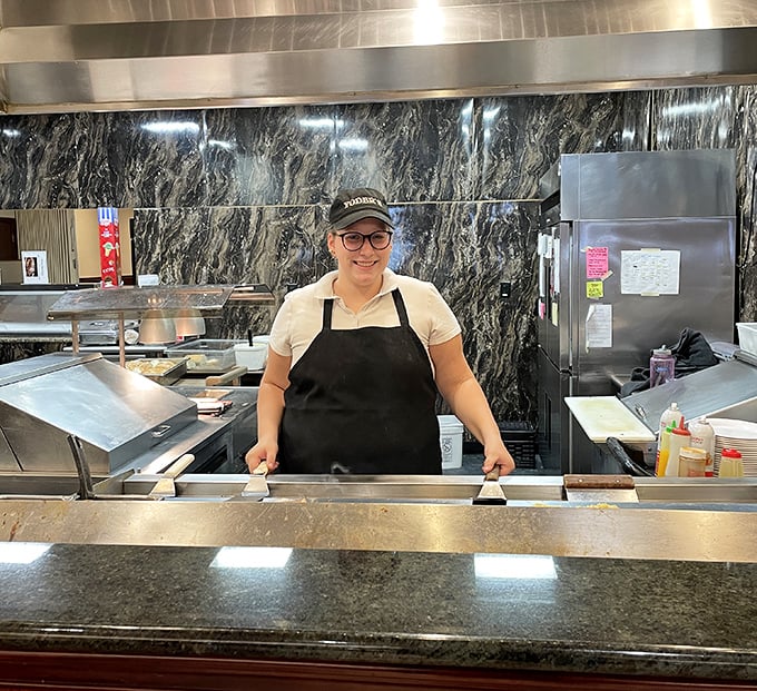 Behind every great buffet is a team that takes pride in their work – that smile says everything about the hospitality you'll experience.