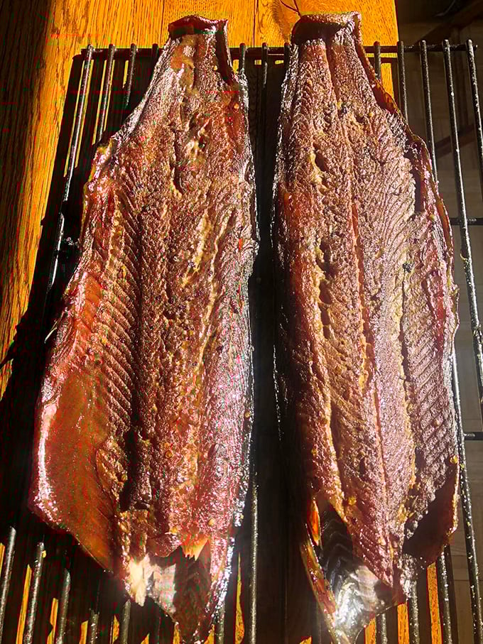 Smoked fish that would make a grizzly bear weep with joy—perfectly preserved with that signature ruby hue that promises deep, penetrating flavor.