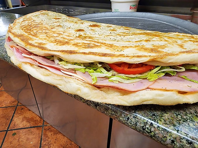 This isn't just a sandwich; it's an engineering marvel of bread, meat, and veggies that requires both hands and your full attention.