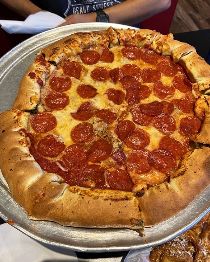 Pizza perfection with a Midwest twist—this pepperoni pie with its golden, puffy crust makes a compelling argument for ordering "just one more slice."