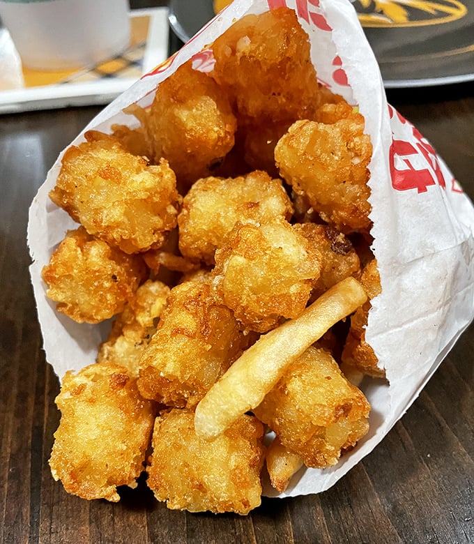 Tater tots nestled in their paper cocoon, waiting to emerge as the butterfly of side dishes they were always meant to be.