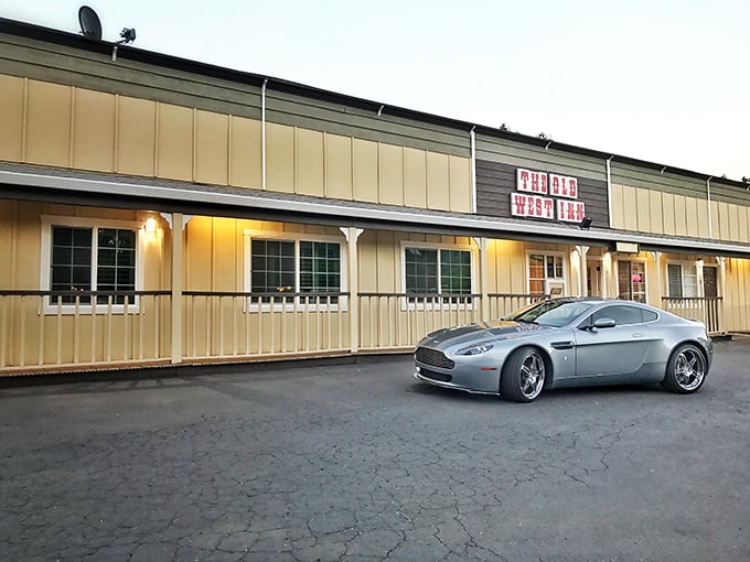 The Old West Inn embraces its frontier theme with charming dedication—and yes, that's an Aston Martin, because cowboys have evolved.