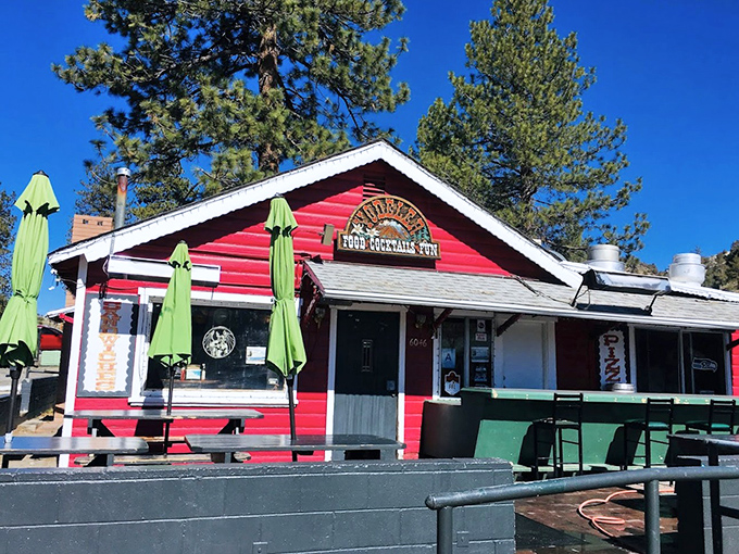The Yodeler's vibrant red exterior isn't just a building – it's a cheerful reminder that mountain dining needn't be all log cabins and taxidermy.
