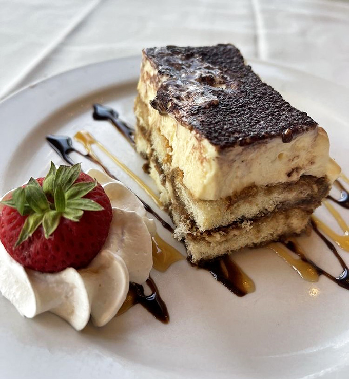 Tiramisu that strikes the perfect balance between cake and cloud. The strawberry isn't garnish – it's a necessary palate cleanser.