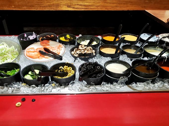 The topping bar doesn't just offer ingredients—it offers possibilities. Each little container holds the power to transform your pizza experience into something personal.