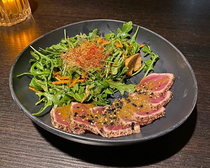 Sesame-crusted tuna that's perfectly pink in the middle, like nature's most delicious bullseye. That salad isn't just a garnish—it's a worthy companion.