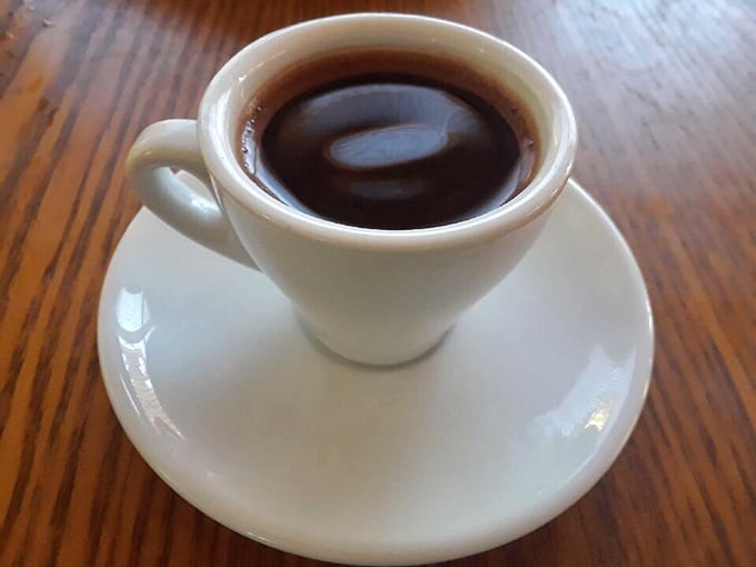 Turkish coffee served the traditional way—intense enough to make your regular morning brew seem like dishwater by comparison.