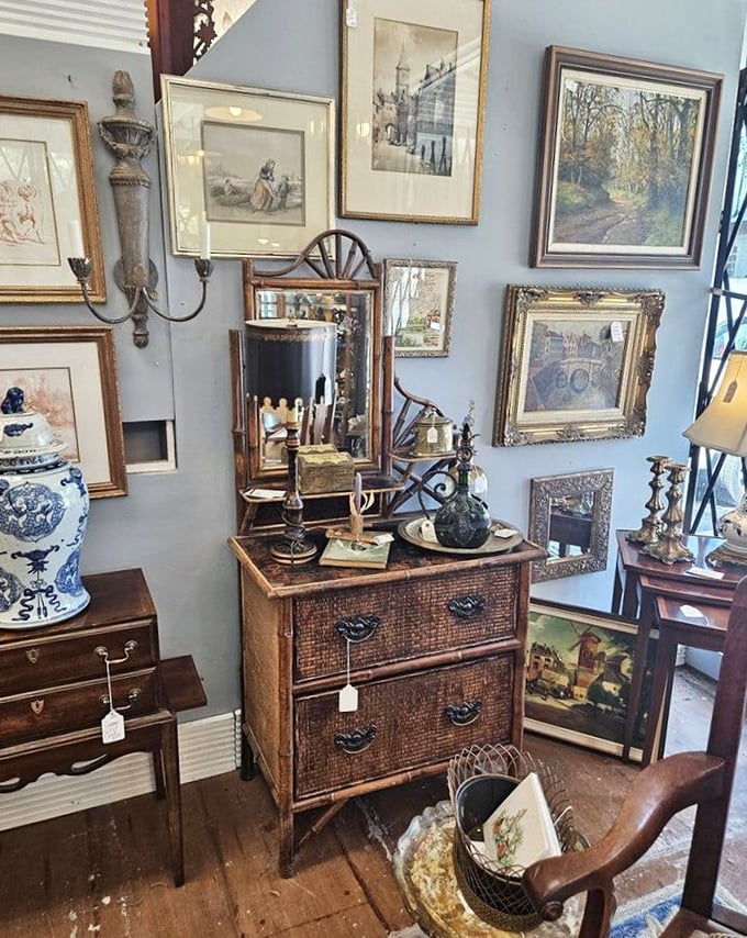 A vignette that's part English manor, part treasure map—where blue walls make the perfect backdrop for centuries of collecting distilled into one corner.