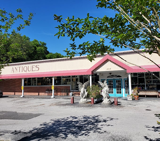 Village Antique Mall stands ready to fulfill your vintage dreams, guarded by concrete angels who've witnessed decades of shoppers searching for that perfect find.