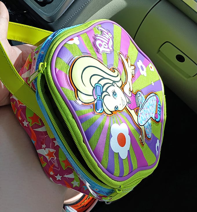 Y2K nostalgia in bag form! This Polly Pocket purse is the time machine you can actually afford.