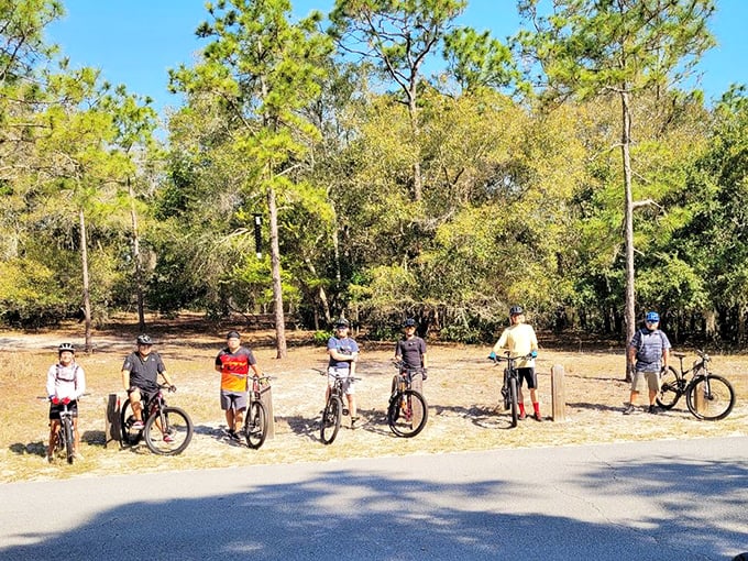 Biking enthusiasts gather before tackling the park's trails. Those smiles suggest they know something about the adventures ahead that you don't—yet.
