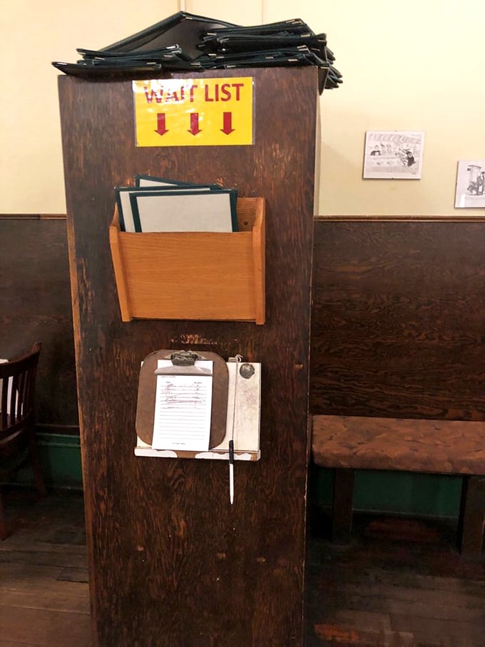 The wait list station—where hope lives on a clipboard and patience is rewarded with the promise of sourdough pancakes to come.