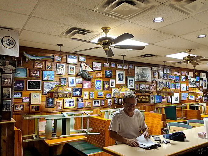 The wall of memories tells stories of epic catches and happy diners – a community built around great seafood.