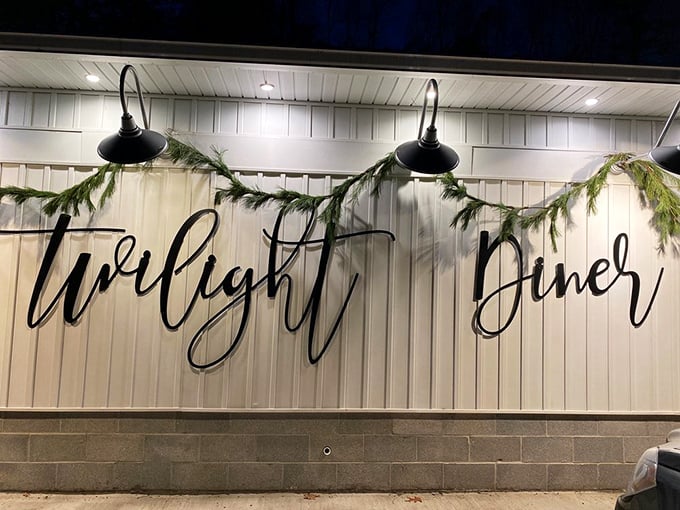 The Twilight Diner logo adorns the wall, surrounded by industrial cage lighting that adds character to this beloved local eatery.