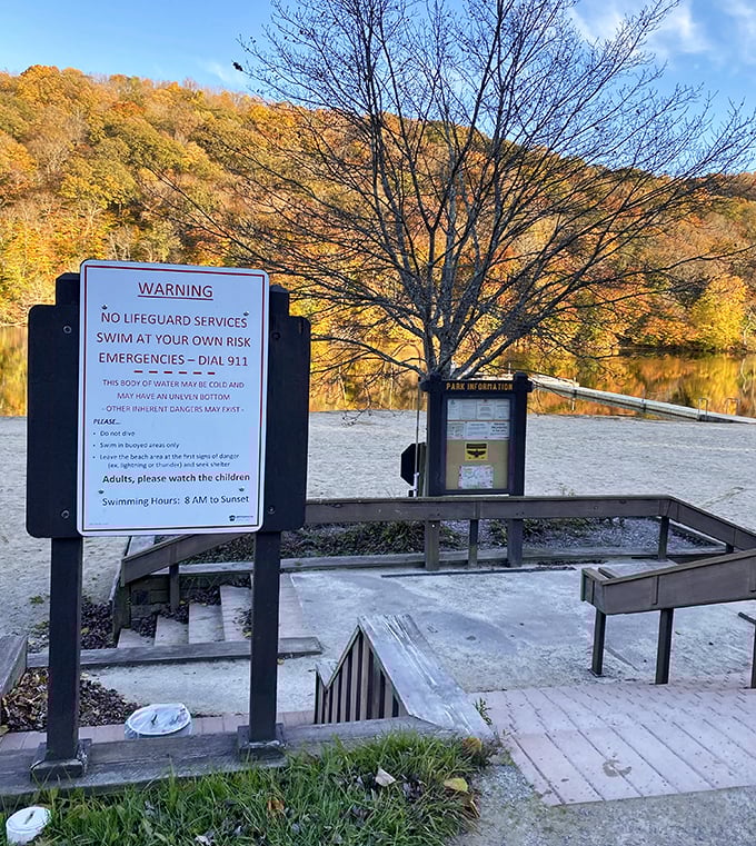 RV camping brings modern conveniences to this wilderness retreat without completely abandoning civilization.
Safety warnings remind swimmers that mountain lakes demand respect, not just Instagram photos.