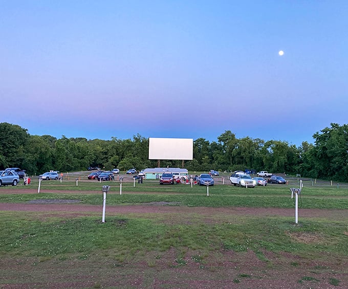 That magical twilight moment when the sky turns periwinkle, the moon appears, and the screen awaits its glowing transformation.