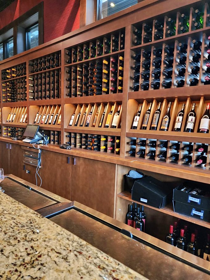 The wine display isn't just storage – it's art. Each bottle waits patiently for its moment to shine at someone's table.
