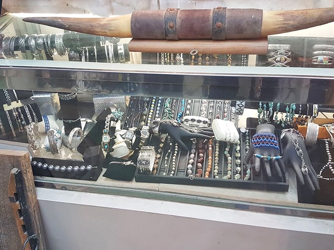 Jewelry display case topped with what appears to be a longhorn—because in Tennessee, even accessory shopping comes with a touch of the wild.