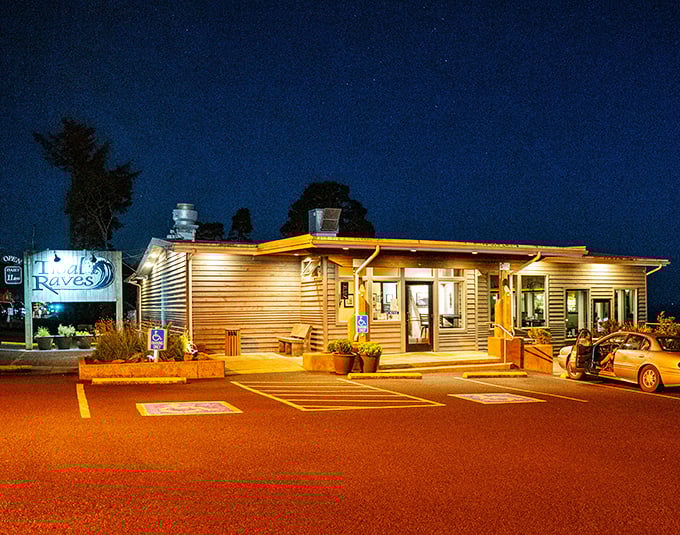 By night, Tidal Raves glows like a lighthouse for hungry travelers. The warm amber light promises comfort and seafood dreams come true.