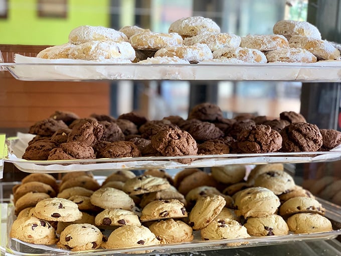 The dessert case at Popi's—where willpower goes to die and "I'll just have a bite" becomes the lie we tell ourselves.