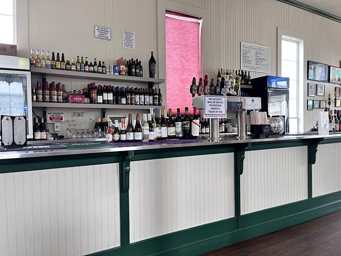 The bar at Phil's isn't just serving drinks – it's dispensing liquid courage for your next adventurous seafood selection.