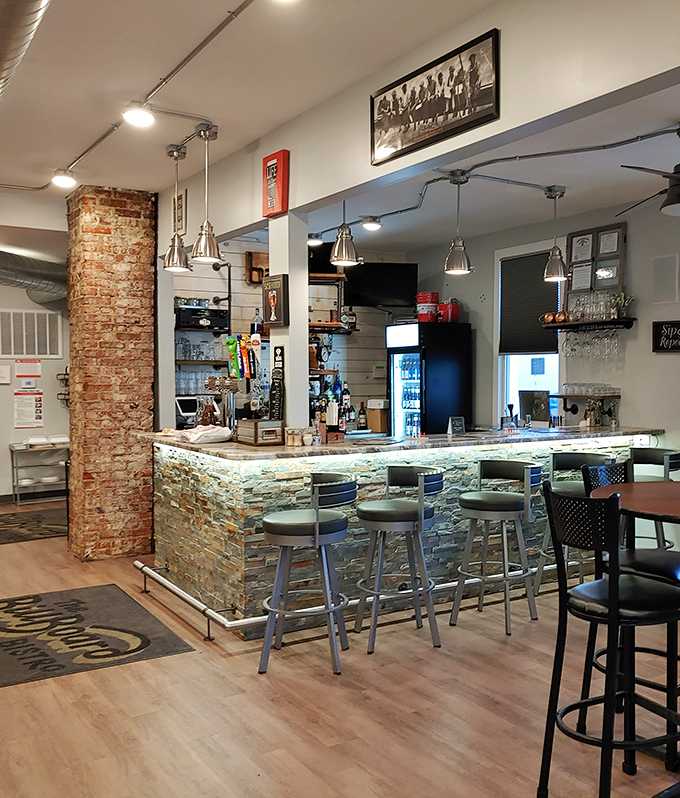 The stone-faced bar with its subtle lighting creates an atmosphere that says, "Stay awhile, your diet can resume tomorrow."