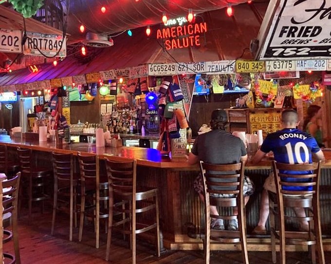 The bar at Champy's isn't just where drinks are served—it's where strangers become friends and food stories are exchanged like currency.