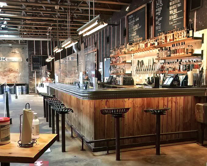 The bar isn't just serving drinks; it's offering liquid companionship for your barbecue journey through a wonderland of wood and whiskey.