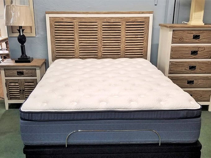 The beachy headboard and pristine mattress combo offers the promise of island dreams without the sand in uncomfortable places—Florida sleeping at its finest.