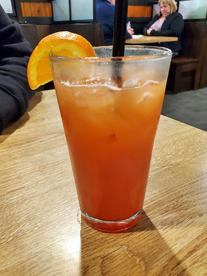 This isn't just a cocktail – it's liquid sunshine with an orange slice smile. The perfect companion while you contemplate which steak to order.