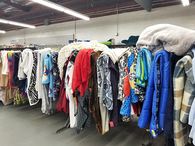 A textile tapestry of patterns and textures—where one person's discarded winter coat becomes another's cozy treasure.