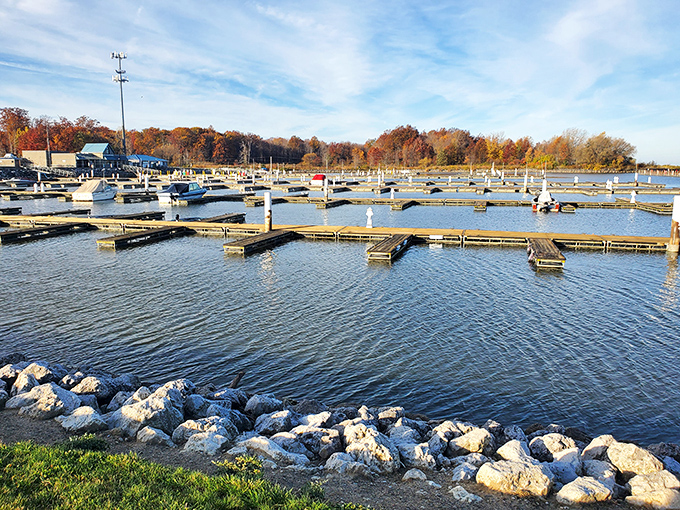The marina stands ready for boating adventures, with docks stretching like fingers into the water, beckoning sailors and dreamers alike.