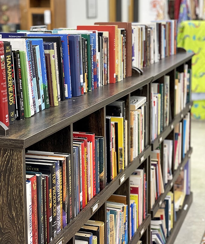 The bookshelf where literary treasures await new readers. Spy that copy of "Hammer and Nails"? Someone's DIY dreams are about to come true.