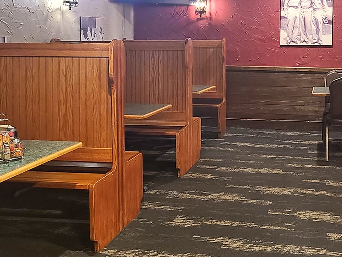 Classic wooden booths offer that old-school pizzeria comfort – where countless family dinners and first dates have unfolded over slices and stories.