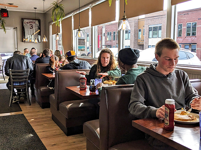 Booths filled with locals and visitors alike, all united in the universal language of "pass the syrup, please."