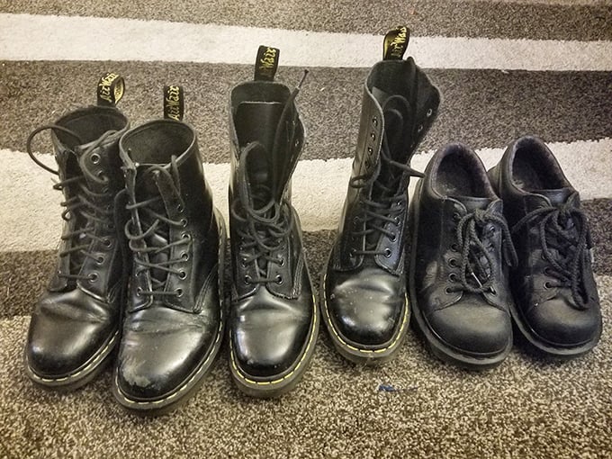 Doc Martens lined up like old friends at a reunion, each scuff telling stories of concerts, protests, or just Tuesday afternoons.