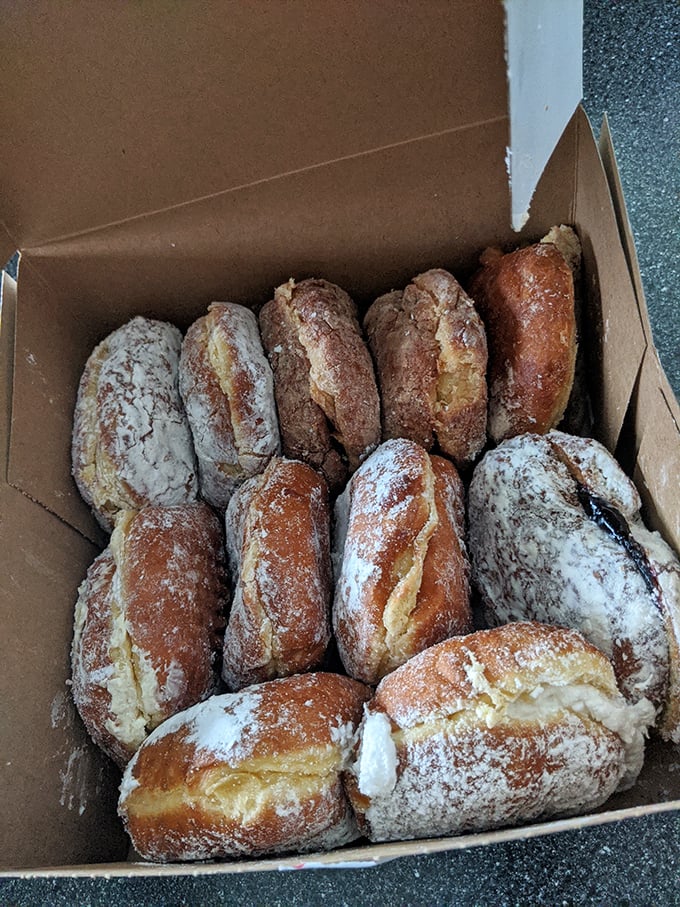 This box doesn't contain donuts—it contains moments of pure bliss, dusted with powdered sugar and memories-in-waiting.