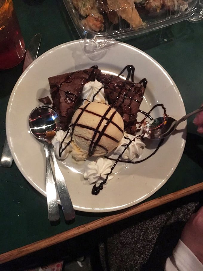 Brownie à la mode with chocolate drizzle—because after conquering the sea, you deserve a sweet victory celebration on dry land.
