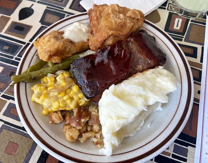 The perfect buffet plate doesn't exi— Oh wait, here it is. A masterclass in strategic food arrangement that hits all the comfort food groups.