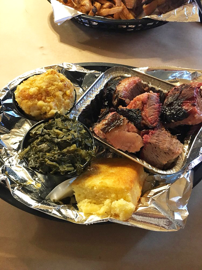 A burnt ends platter that showcases barbecue's greatest magic trick: turning the toughest cut into the most coveted. The collard greens know they're in good company.