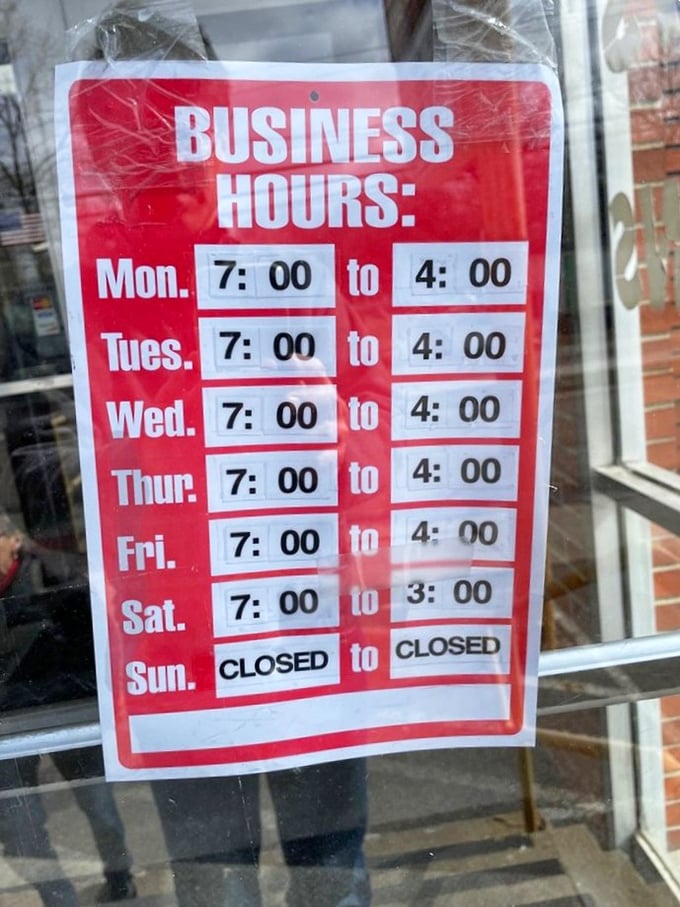 The business hours sign—a crucial piece of information that prevents the heartbreak of arriving to find closed doors between you and biscotti.