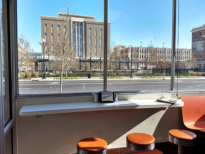 Window seats offer prime people-watching with a side of nostalgia. Urban theater paired perfectly with comfort food.