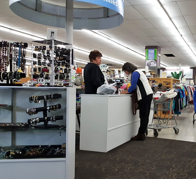 The checkout area—where friendly volunteers turn your treasure hunt into a community connection, one conversation and receipt at a time. 