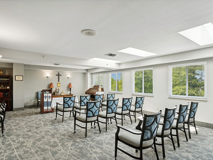 A serene chapel space offers spiritual comfort and community gatherings, with natural light that seems to underscore moments of reflection. 