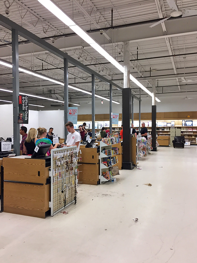 Checkout counters bustling with treasure hunters comparing their bounty like archaeologists who've just raided the retail equivalent of King Tut's tomb.