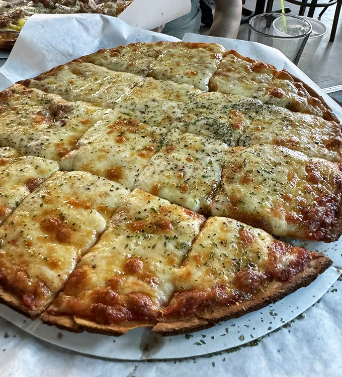 Cheese pizza perfection isn't as simple as it looks. That golden ratio of sauce to cheese to crust is the result of pizza wisdom passed through generations.