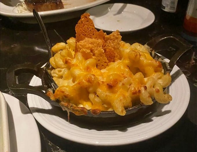 This isn't just mac and cheese – it's a bubbling cauldron of comfort that's had a sophisticated makeover with truffle and crispy edges.